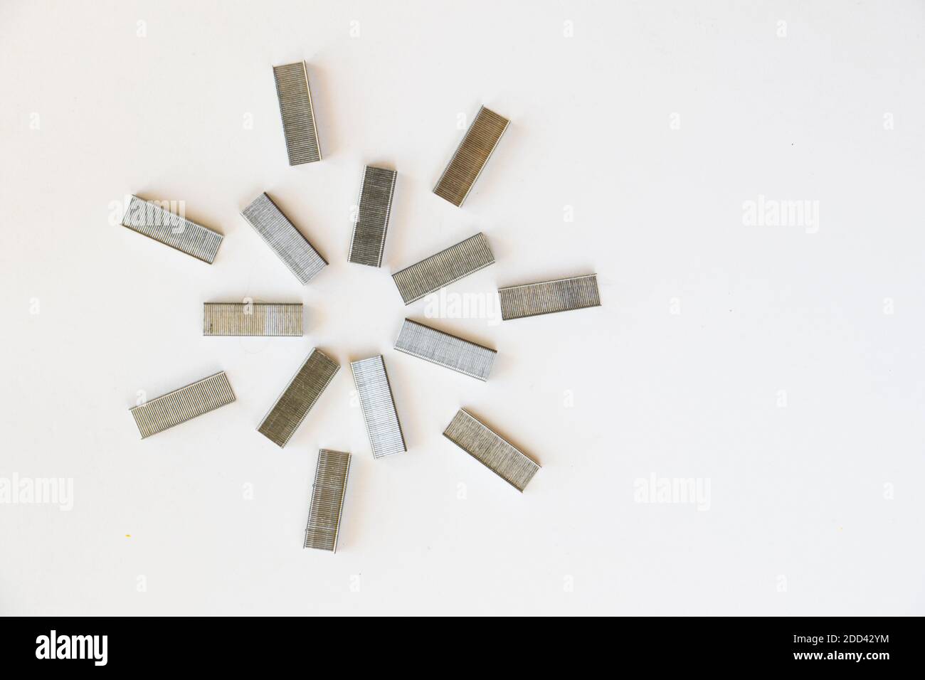 Paper staples pile on the white background, circle form Stock Photo - Alamy