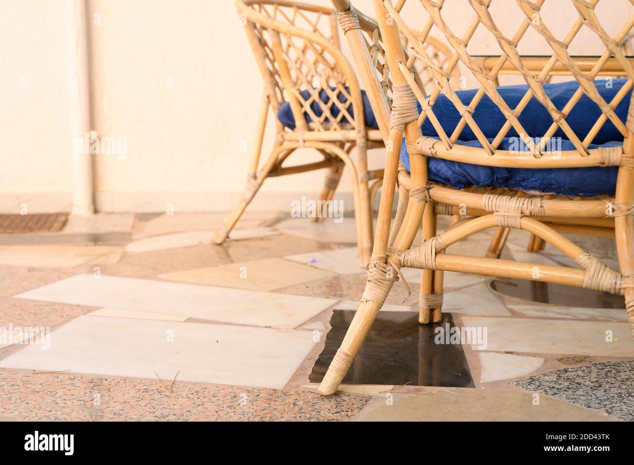 wicker wooden chairs and coffee table for relaxing and socializing with ...