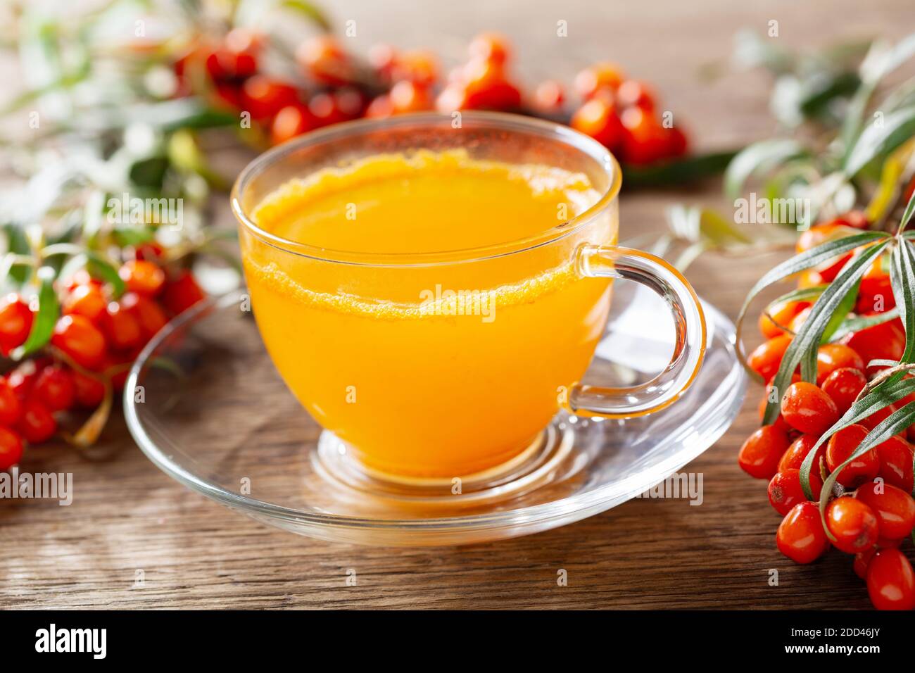 cup of hot sea buckthorn tea with fresh berries on wooden table Stock ...