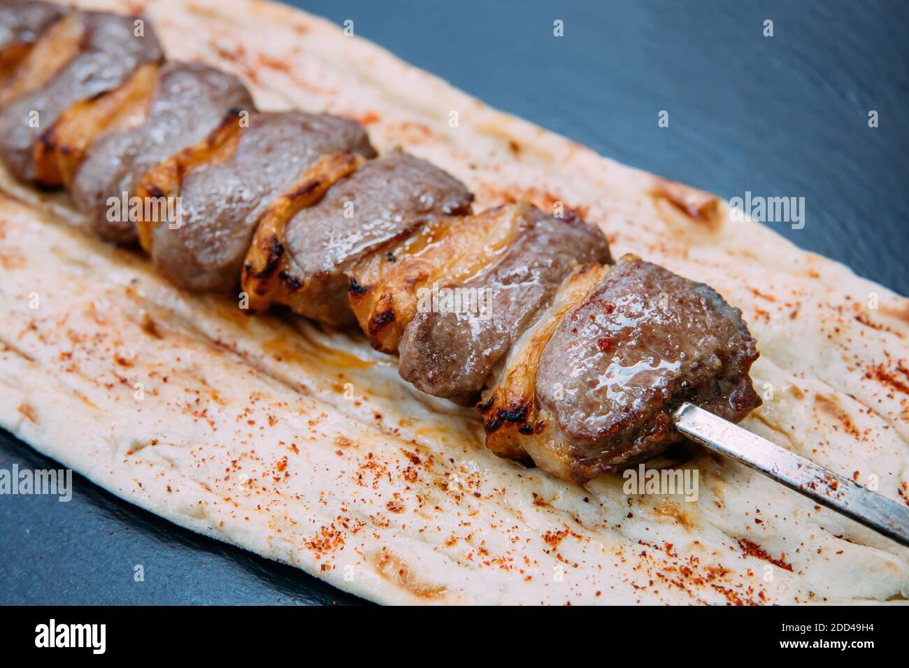Skewers of grilled shish kebab or barbecued shashlik meat Stock Photo ...