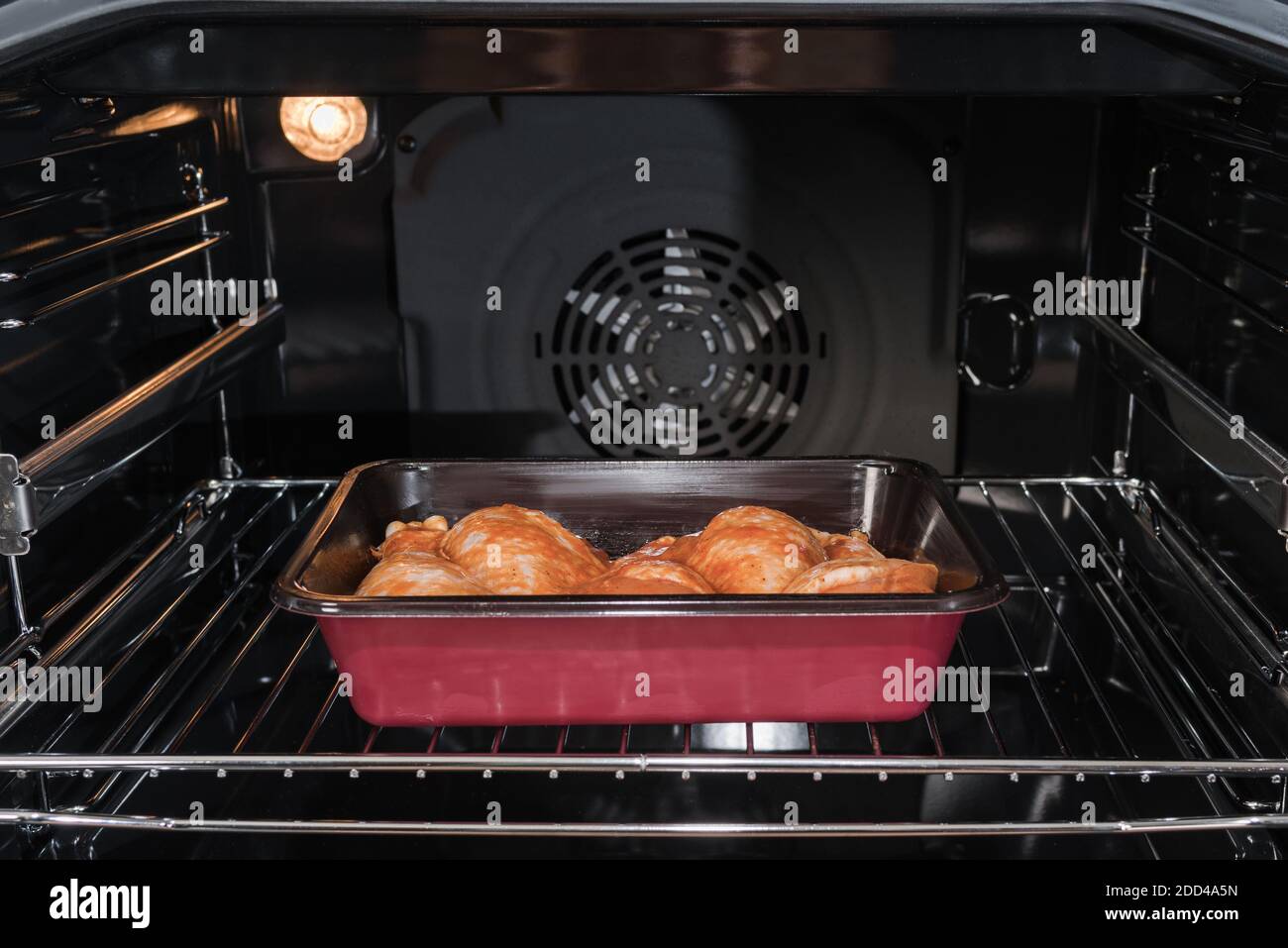 Chicken meat for roasting.Meat in the baking package in the oven for ...