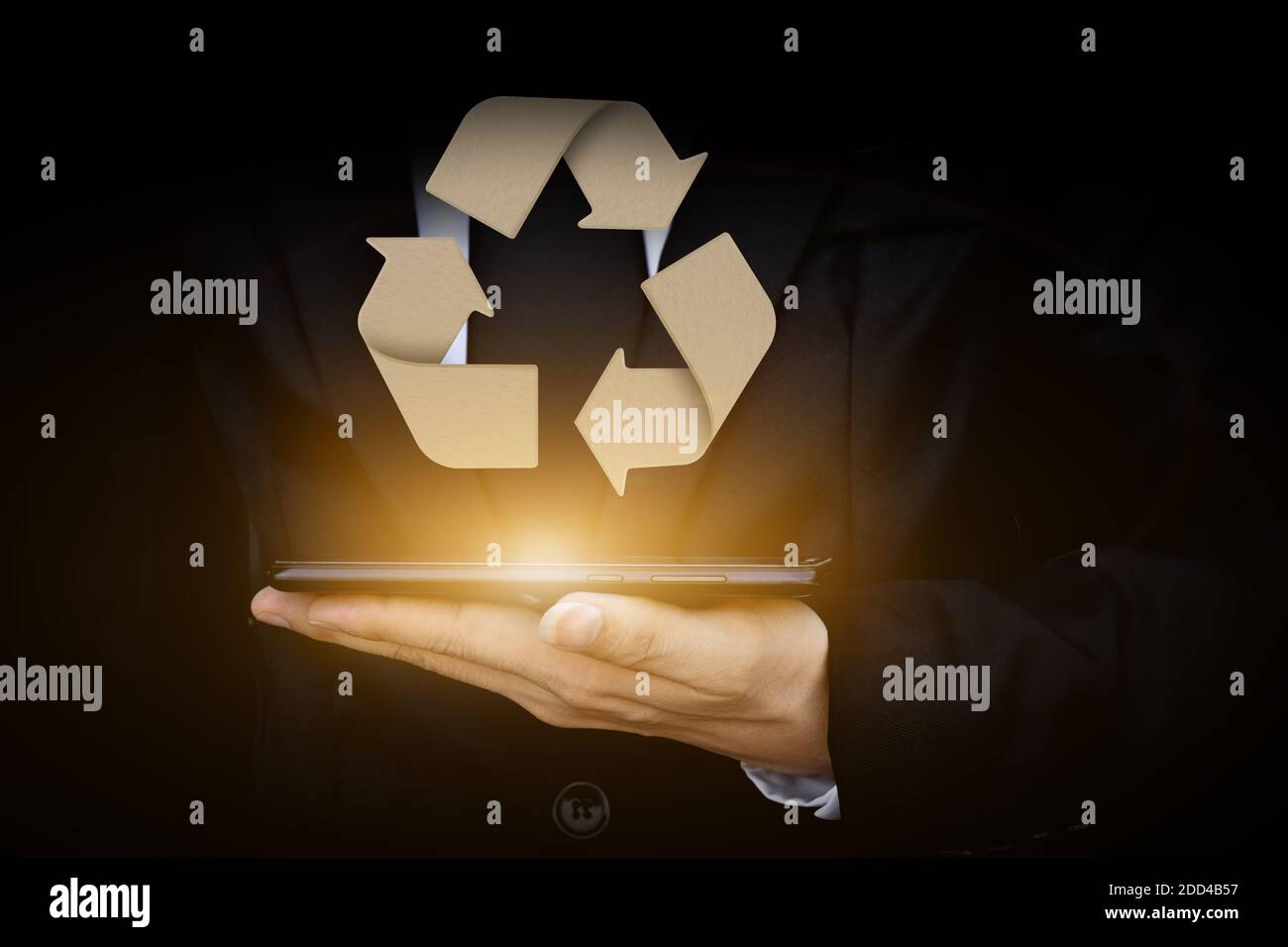 Hand holding mobile phone with recycle logo on black background Stock ...