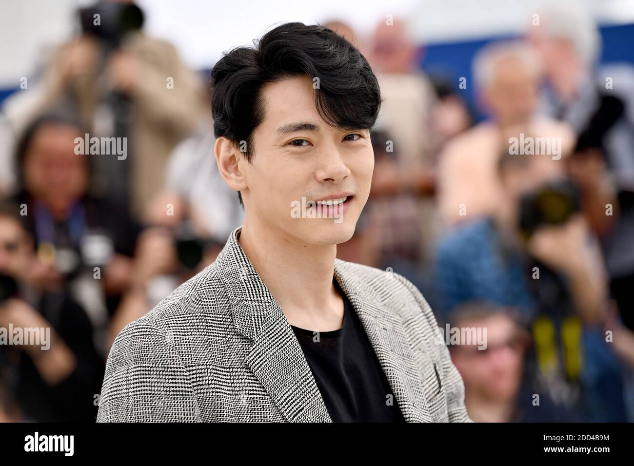 Teo Yoo posing at the Leto photocall held at the Palais des Festivals ...