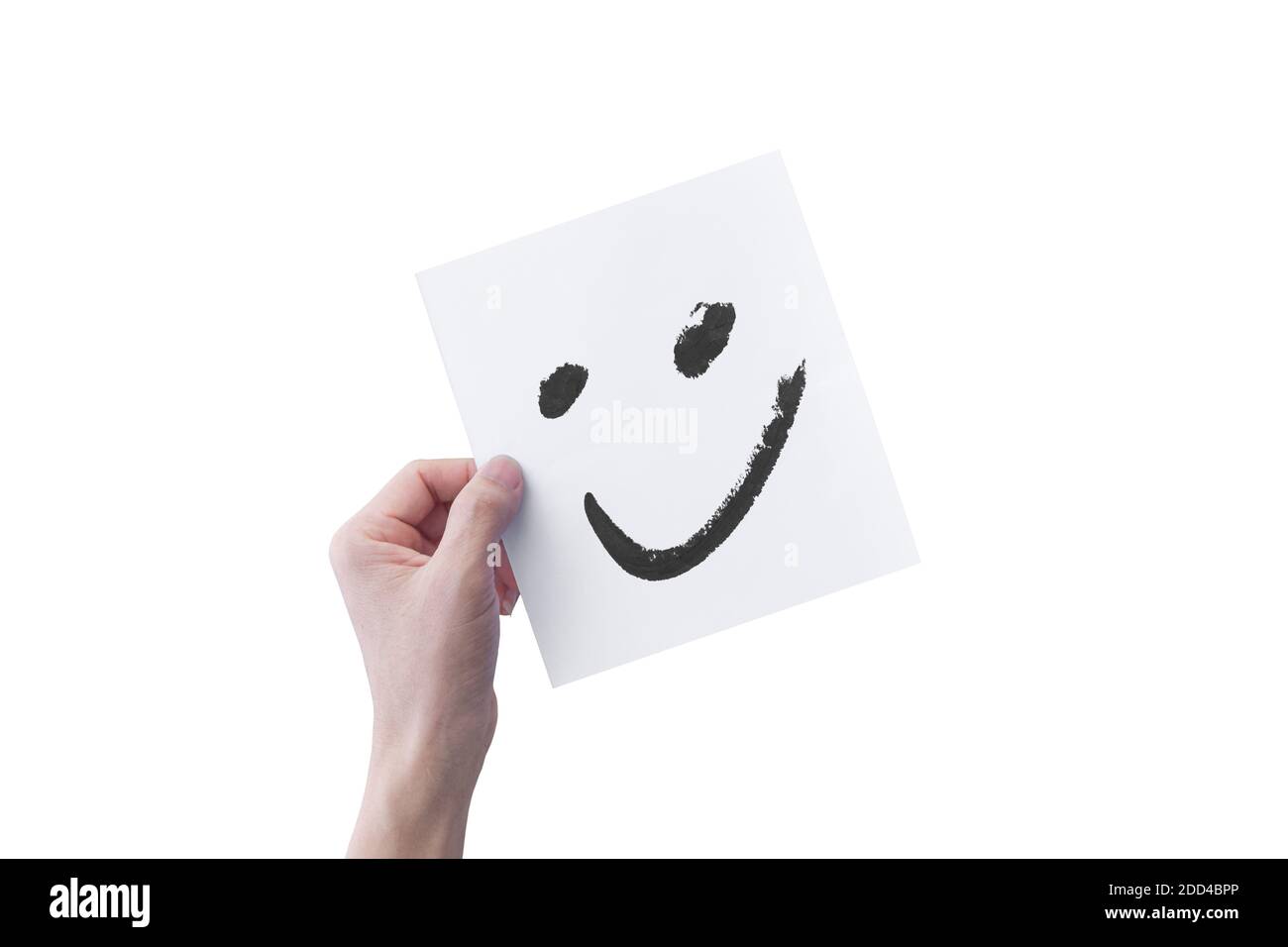 Hand holding white paper with hand drawn smiley face emoticons isolated ...