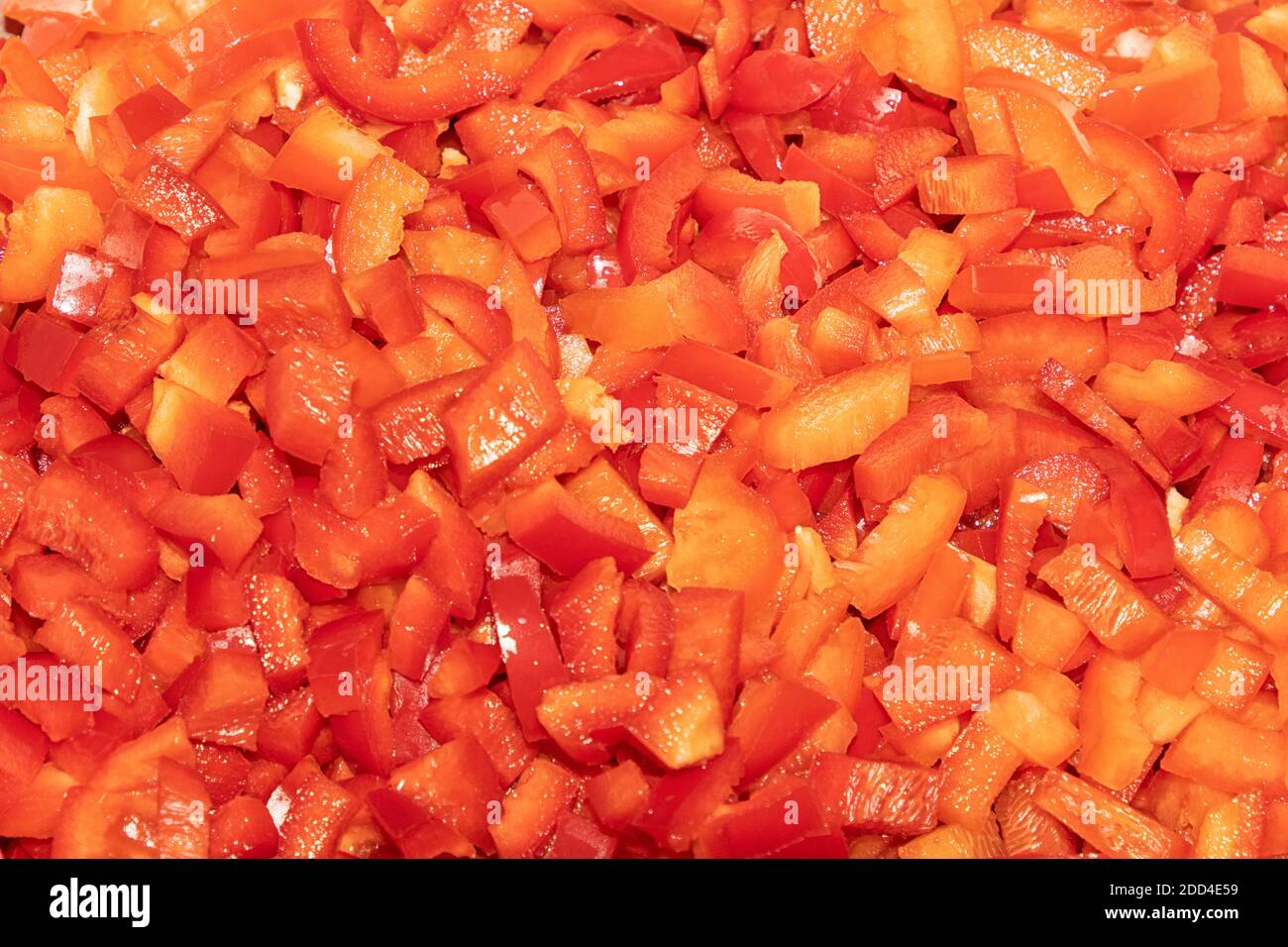whole red chilli laid over chopped chilli background Stock Photo - Alamy