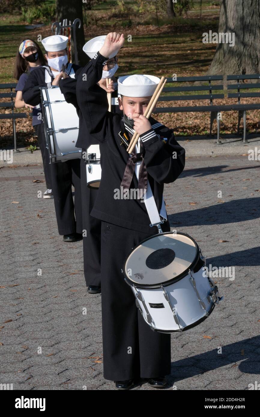Teenagers in the US Naval Cadet Corps marching band rehearse near the ...