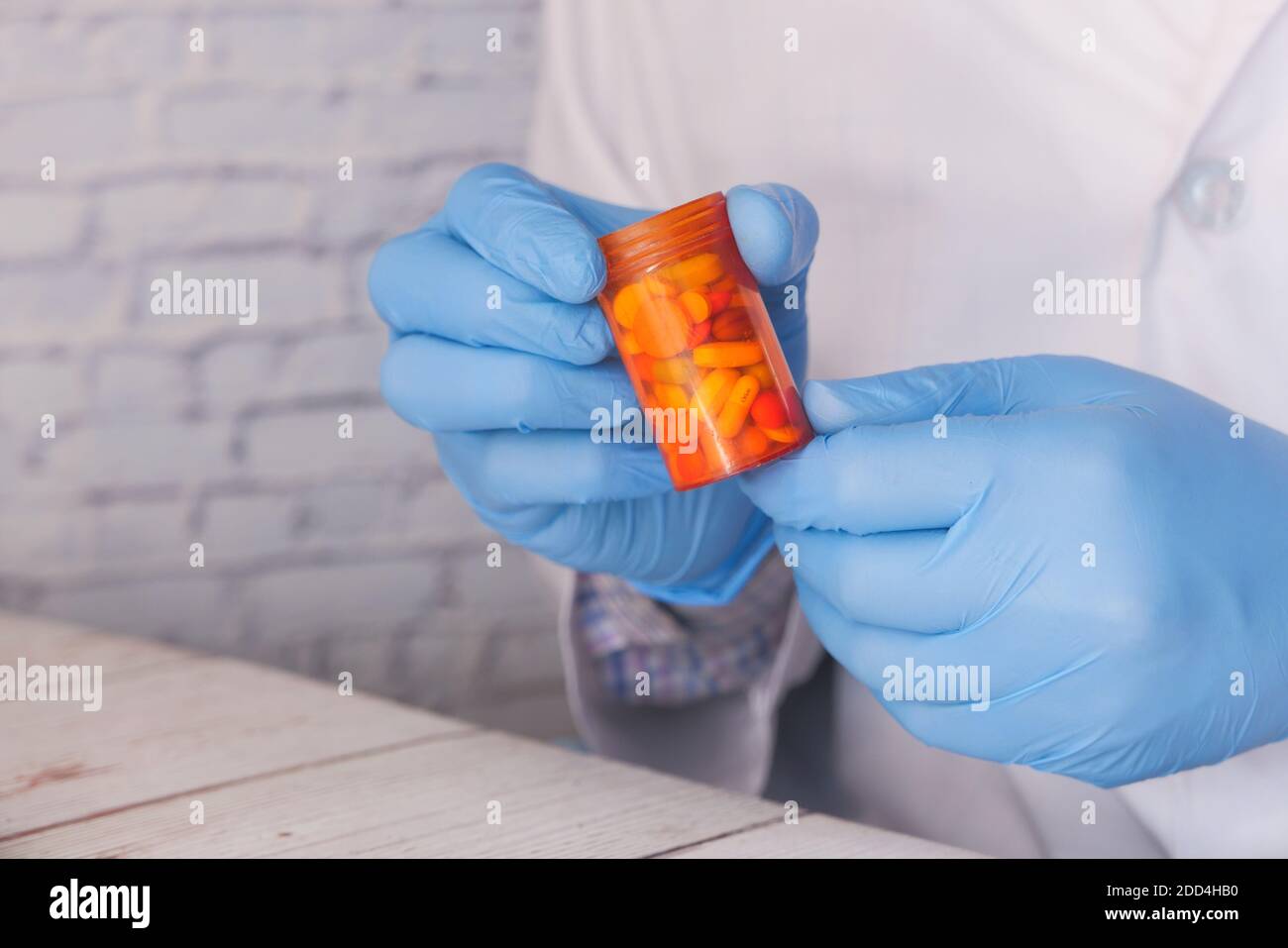 Doctor hand in protective glass hi-res stock photography and images - Alamy