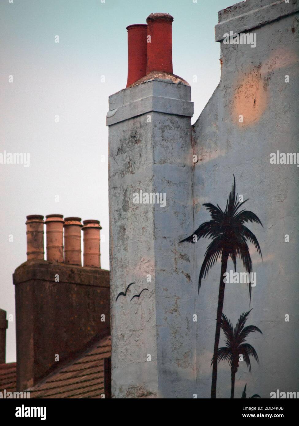 Palm trees painted on the exterior of a house in Brighton Stock Photo ...