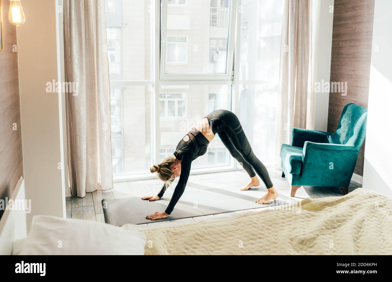 woman in yoga pose at home Stock Photo - Alamy