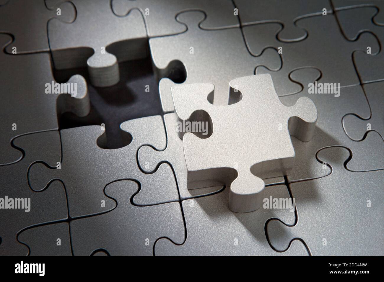Silver puzzle pieces Stock Photo - Alamy