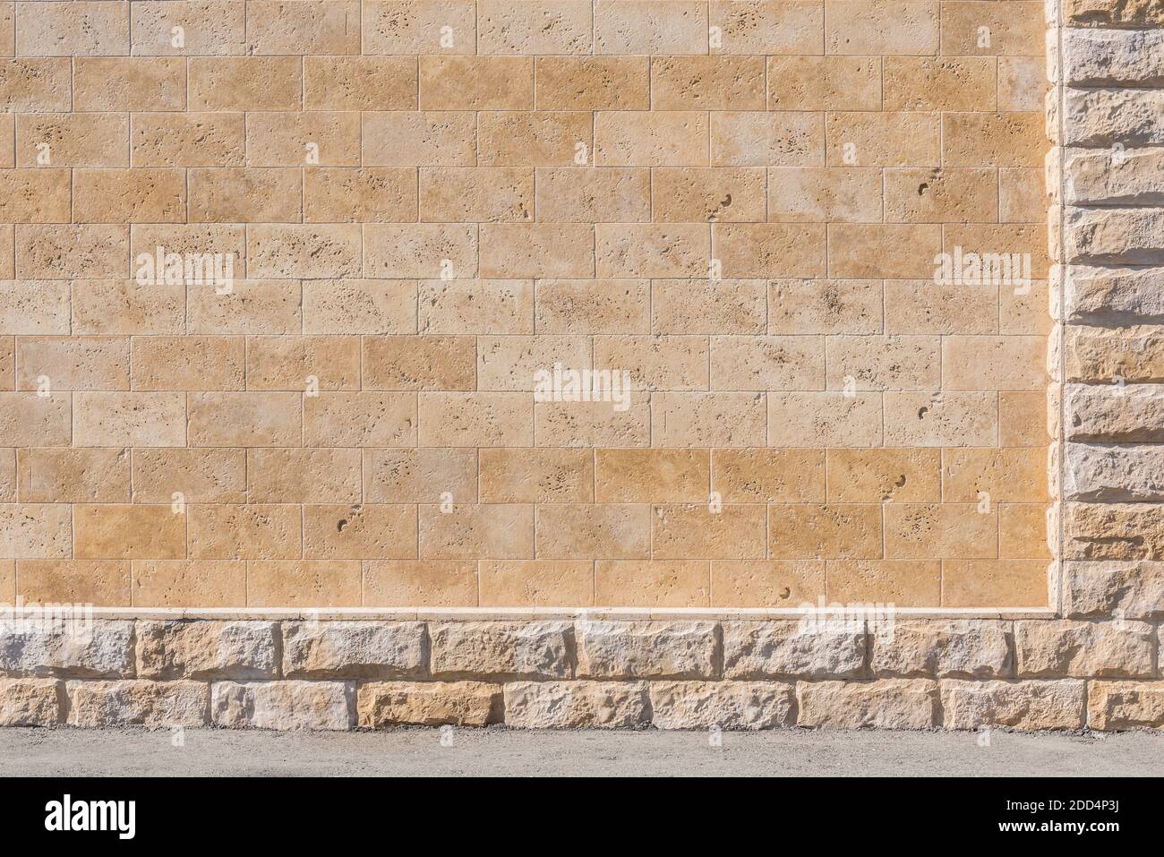 Yellow clean stone wall of the fence Stock Photo - Alamy