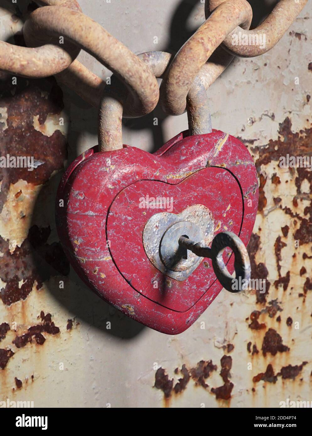 Old rust heart shaped lock with key Stock Photo - Alamy