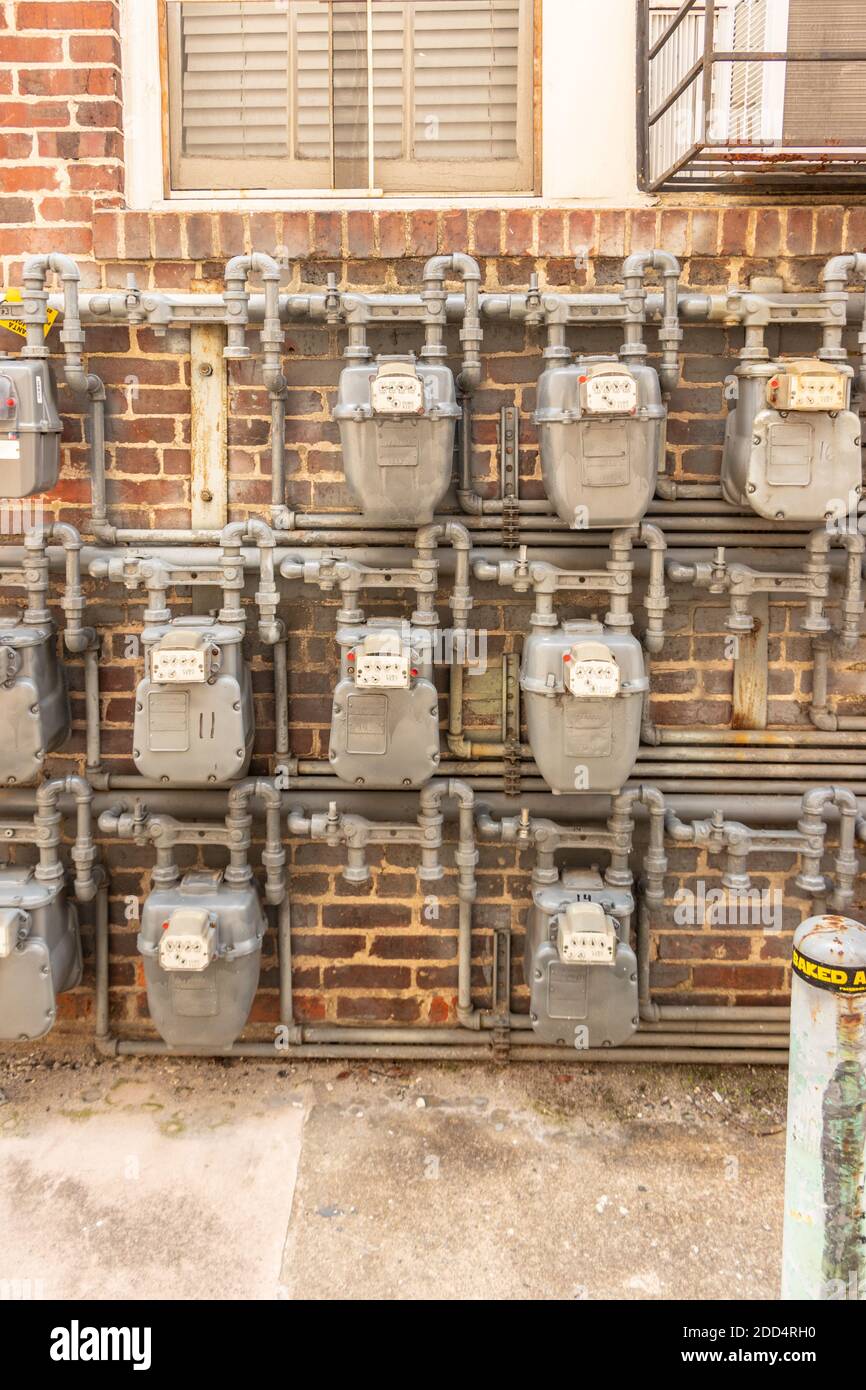 gas meters and intricate pipework outside apartments in Savannah Stock ...