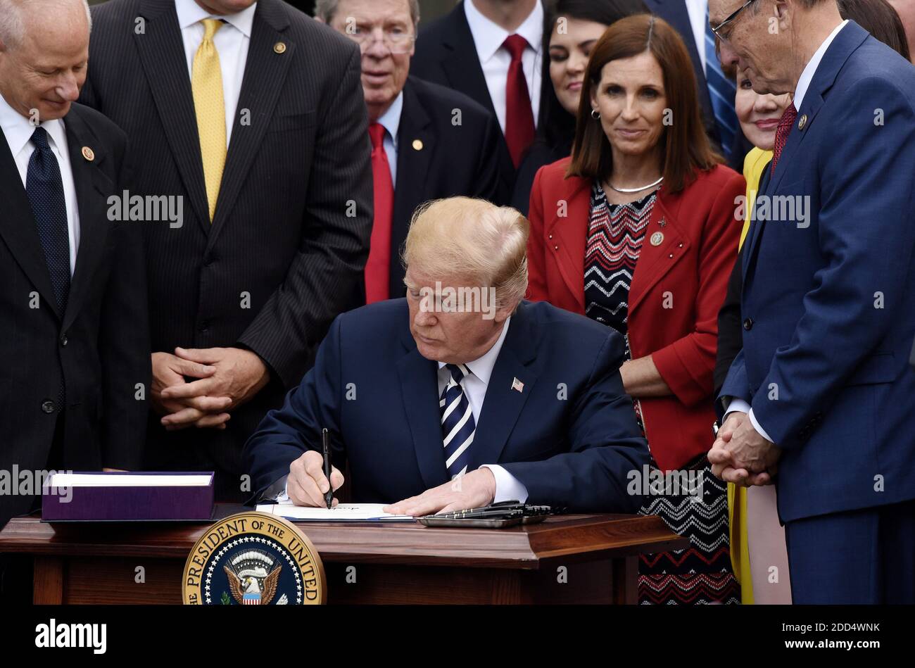 President Donald Trump signs a new veterans healthcare program, the VA ...
