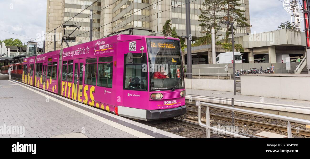 Panorama of a purple tram at the platform in the center of Bonn ...