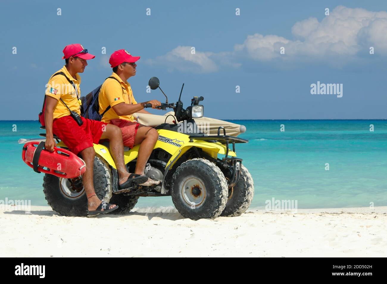 Two lifeguards on beach buggy, Playa del Carmen, Mexico. In the ...
