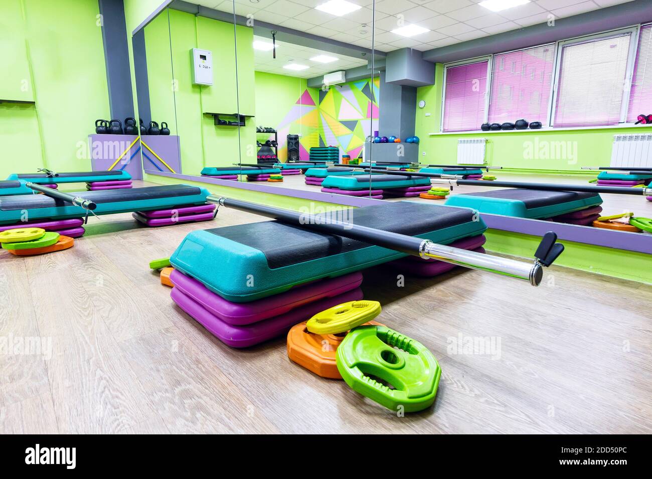 interior of a gym fitness room for training with equipment step-by-step ...