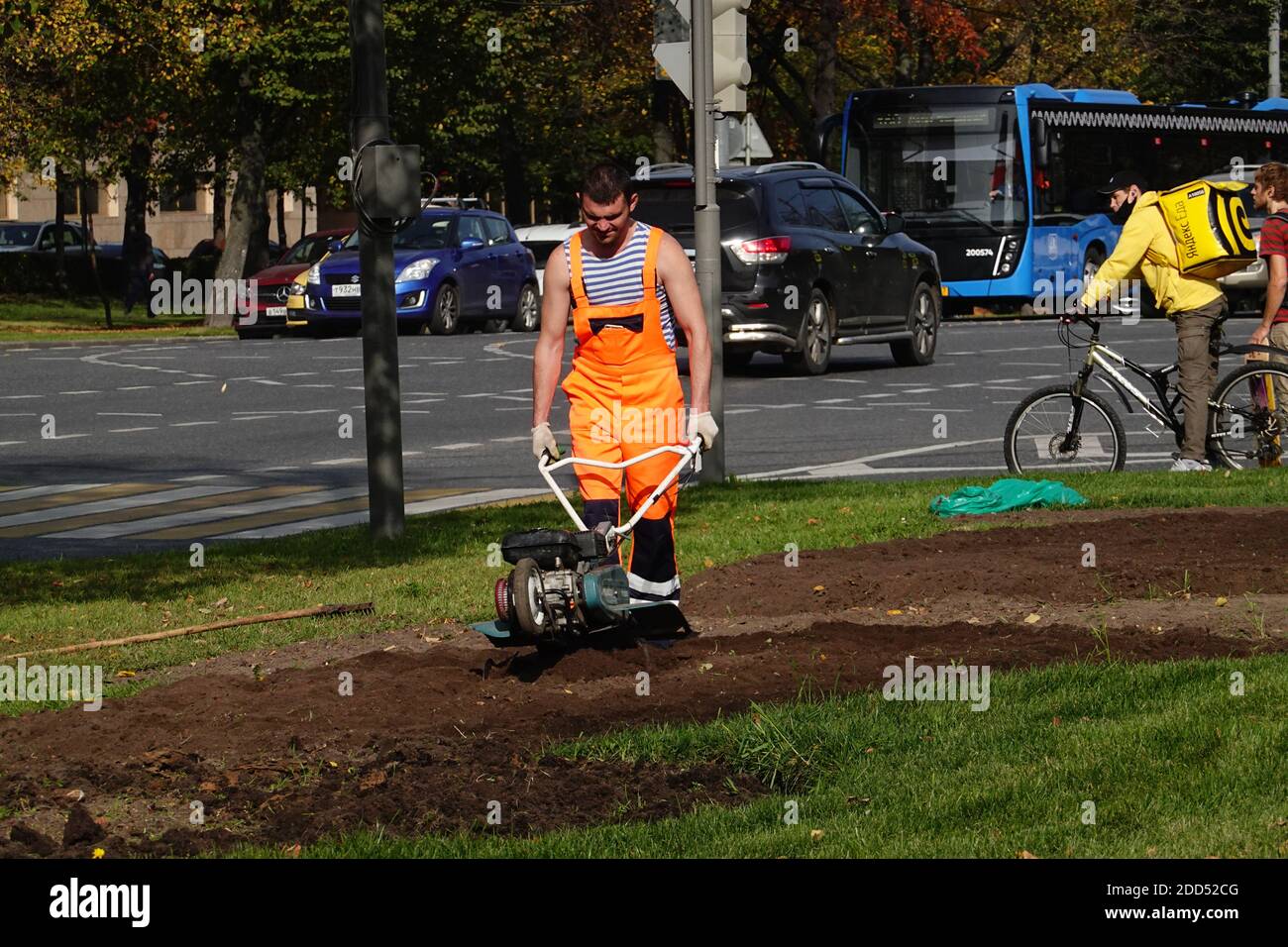 A worker digging the ground on the street Stock Photo - Alamy