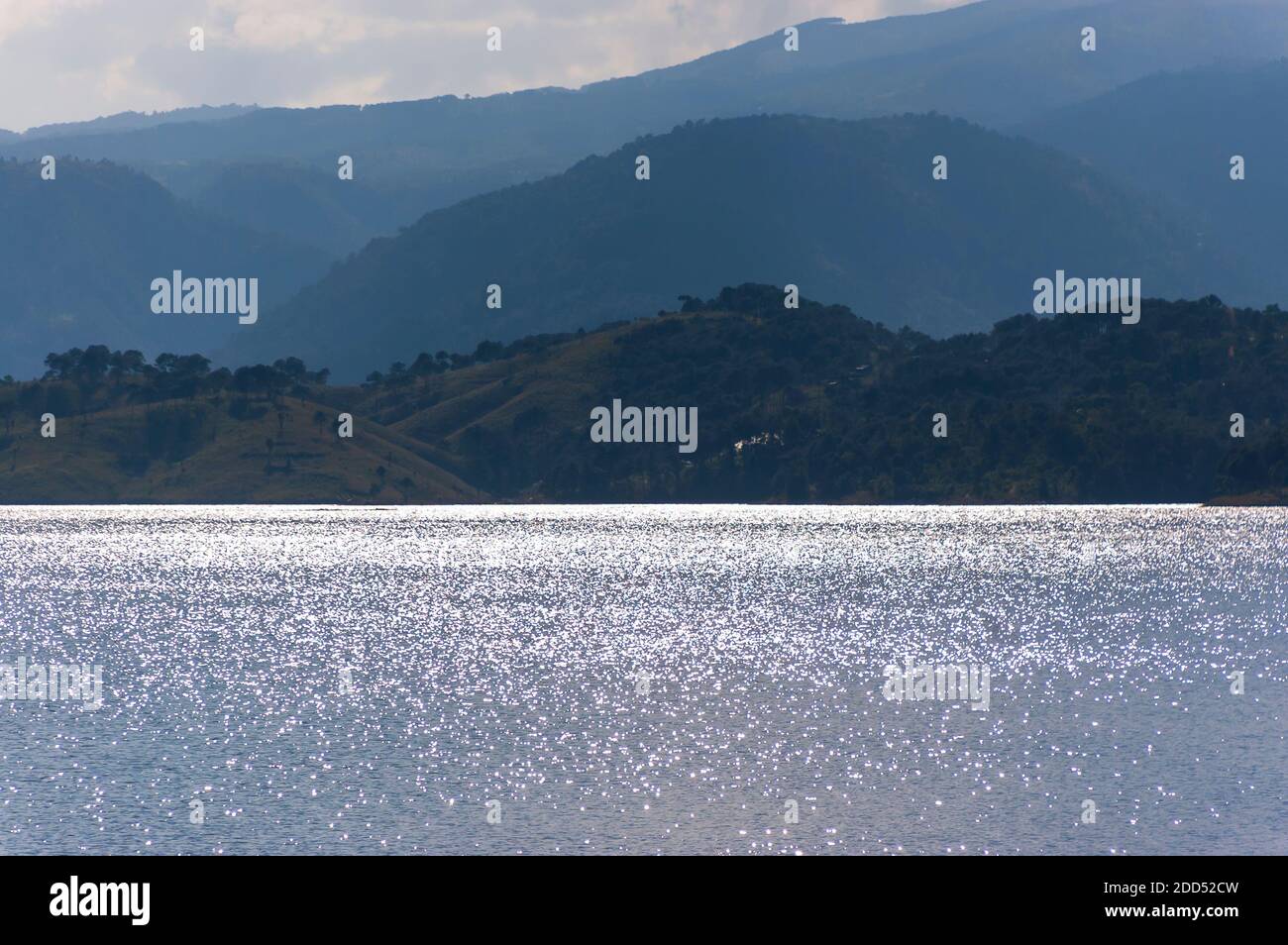 Sunlight reflecting off water waves to cause sun glitter at Umiam lake ...