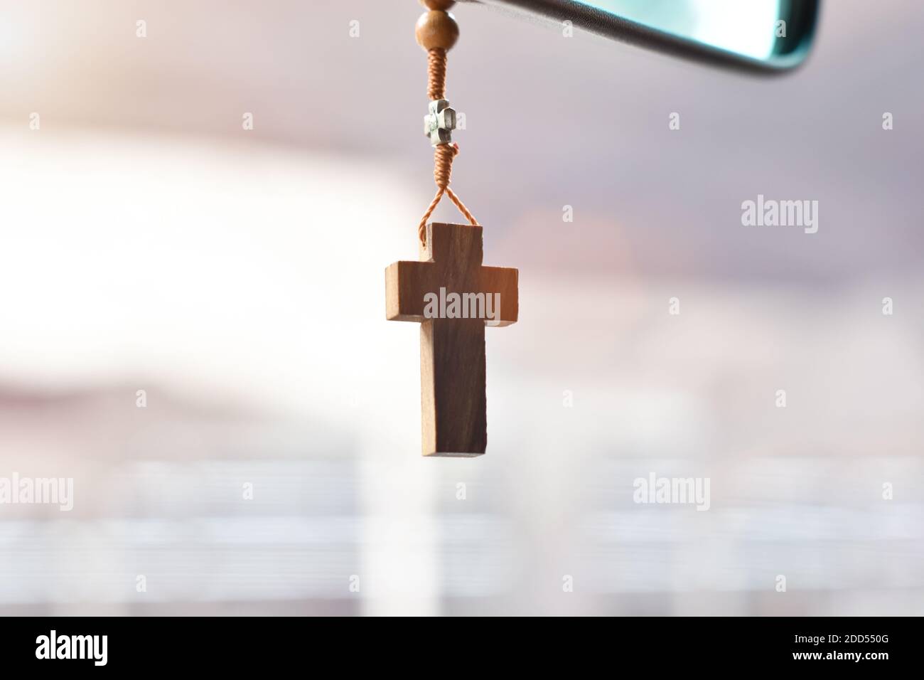 Christian cross hangs on the mirror in the car. Concept of religiosity ...