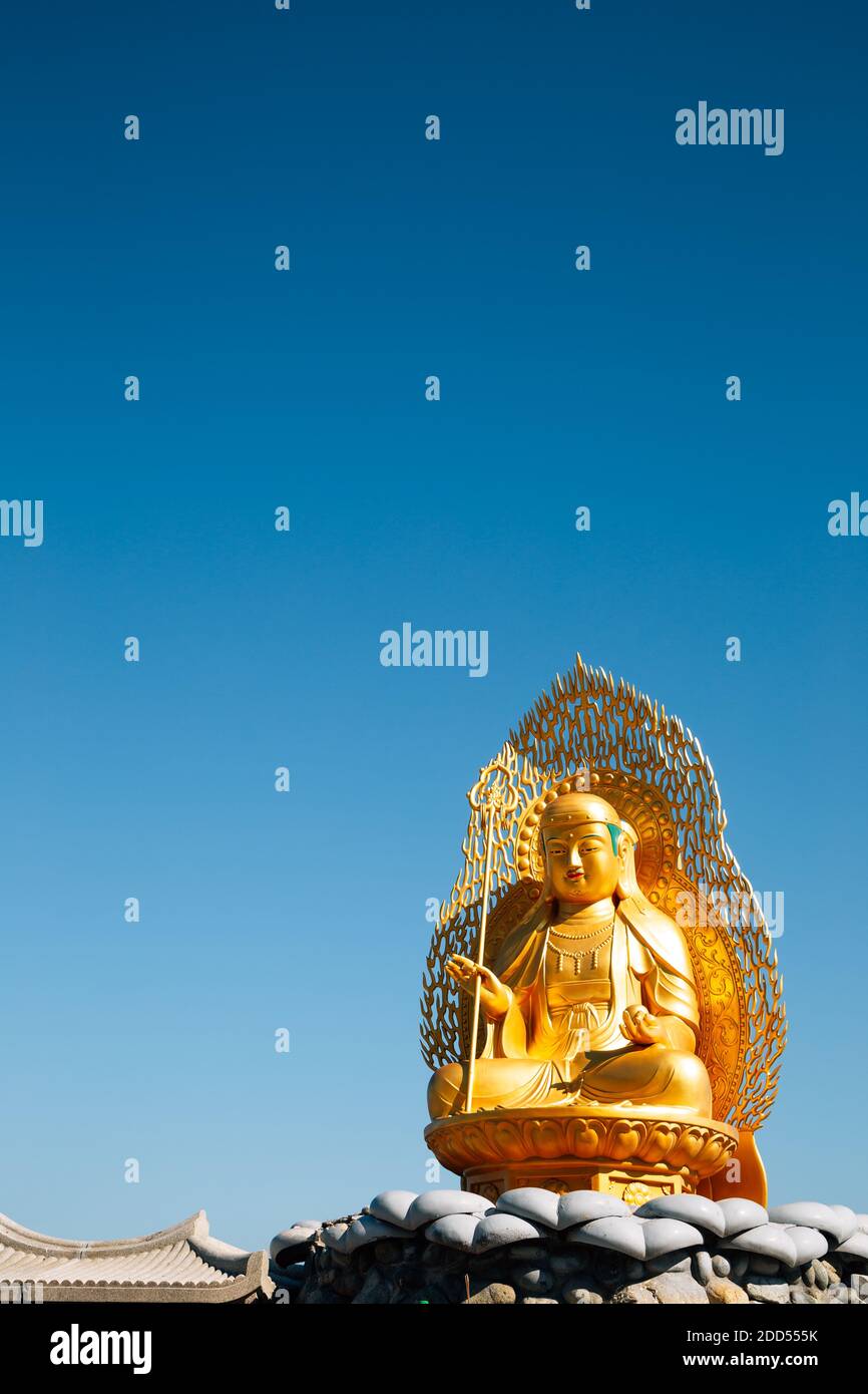 Golden buddha statue at Haedong Yonggungsa Temple in Busan, Korea Stock ...
