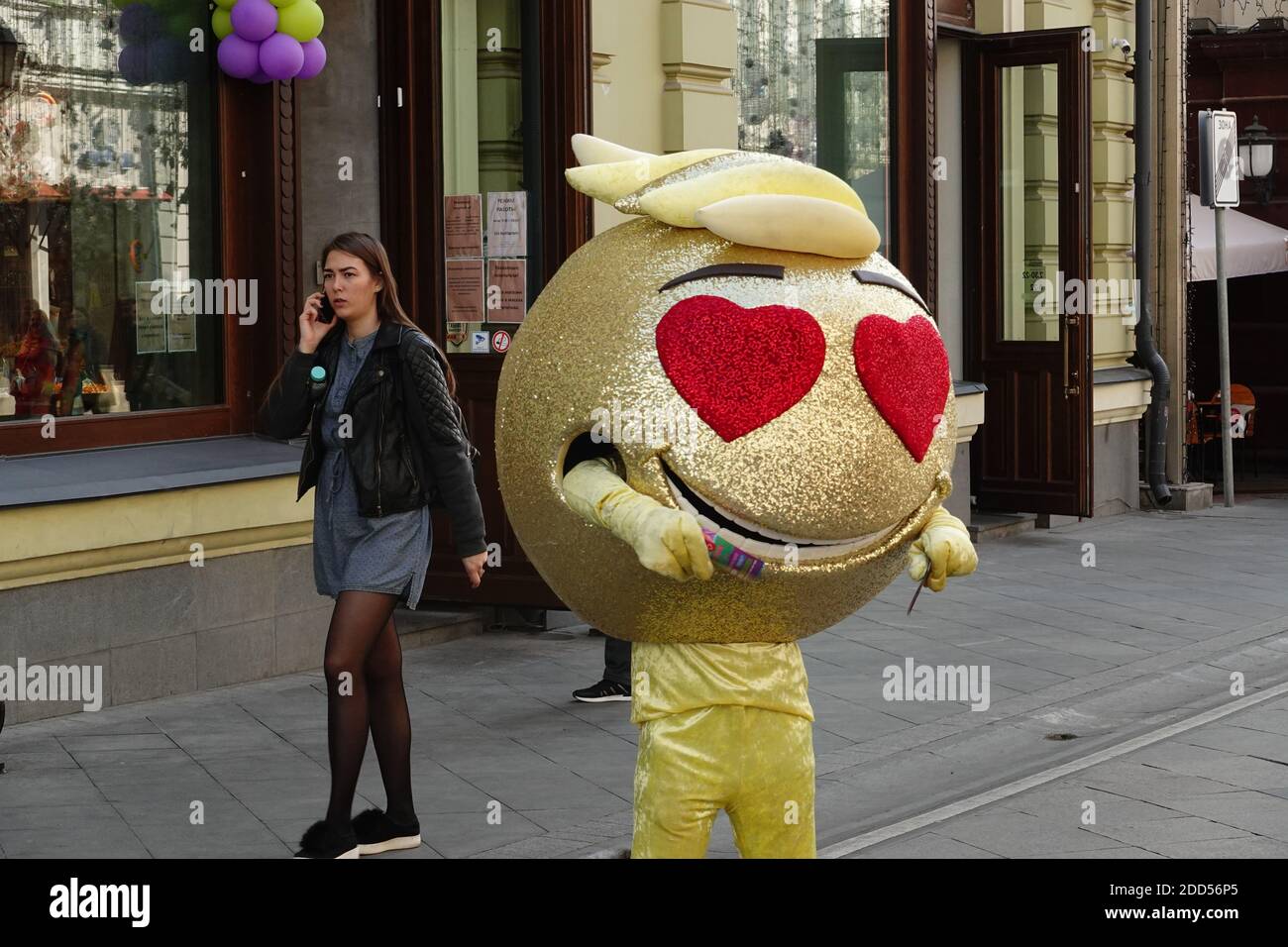 Funny promoter with flyers on Nikolskaya street Stock Photo - Alamy