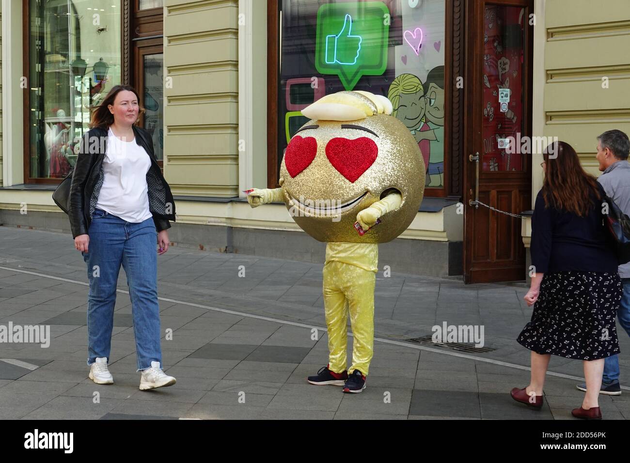 Funny promoter with flyers on Nikolskaya street Stock Photo - Alamy