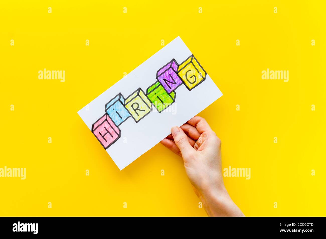 Hiring - job recruting concept. Word Hiring on paper banner, top view ...