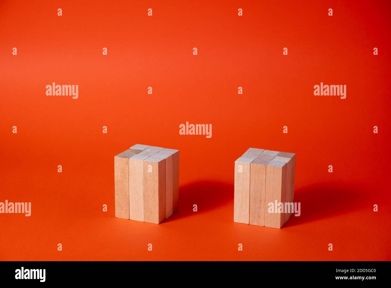 Wooden blank cubic stands podiums on a red background Stock Photo - Alamy
