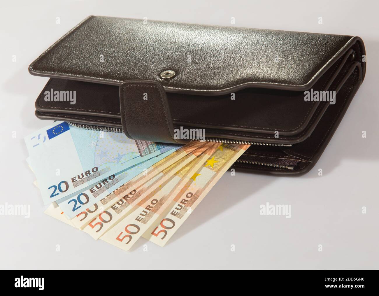 euro banknotes in brown leather purse Stock Photo - Alamy