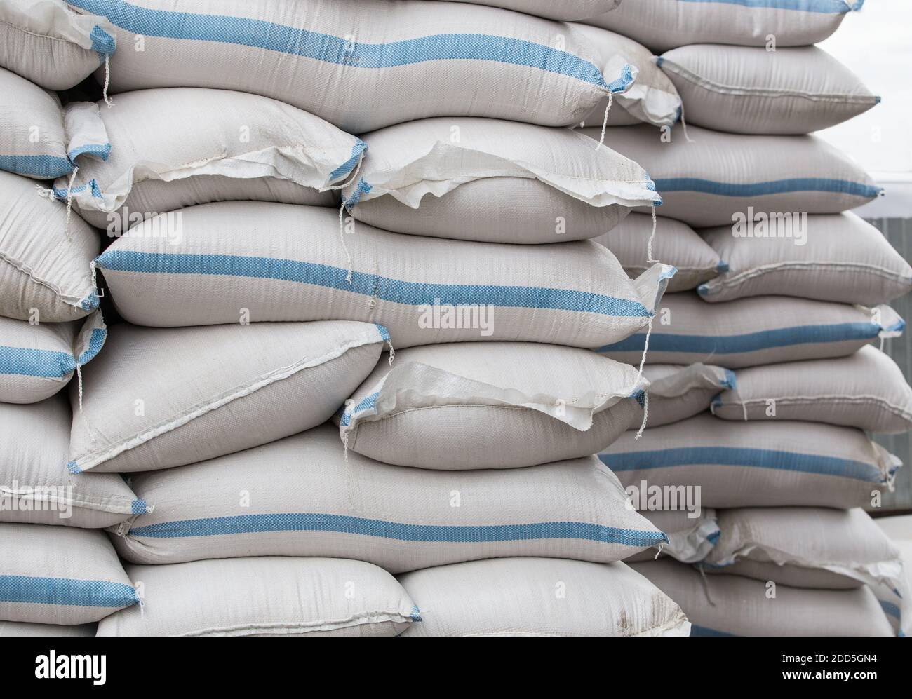 Bags with grains in stacks close-up Stock Photo - Alamy