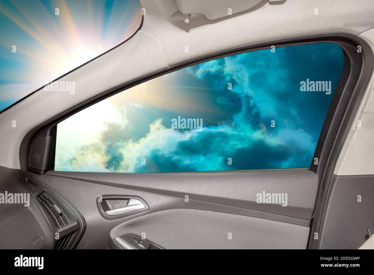Heavenly landscape behind car window Stock Photo - Alamy
