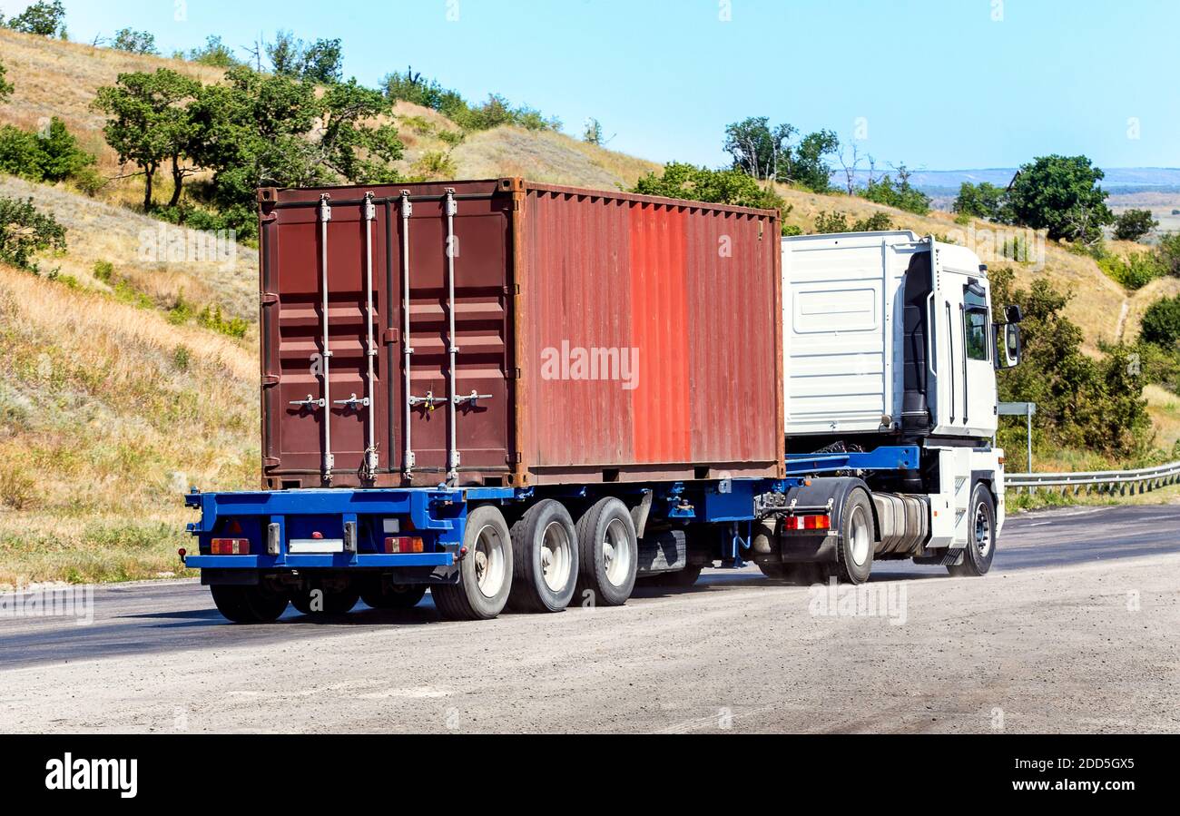 trailer transports container on highway in country Stock Photo - Alamy