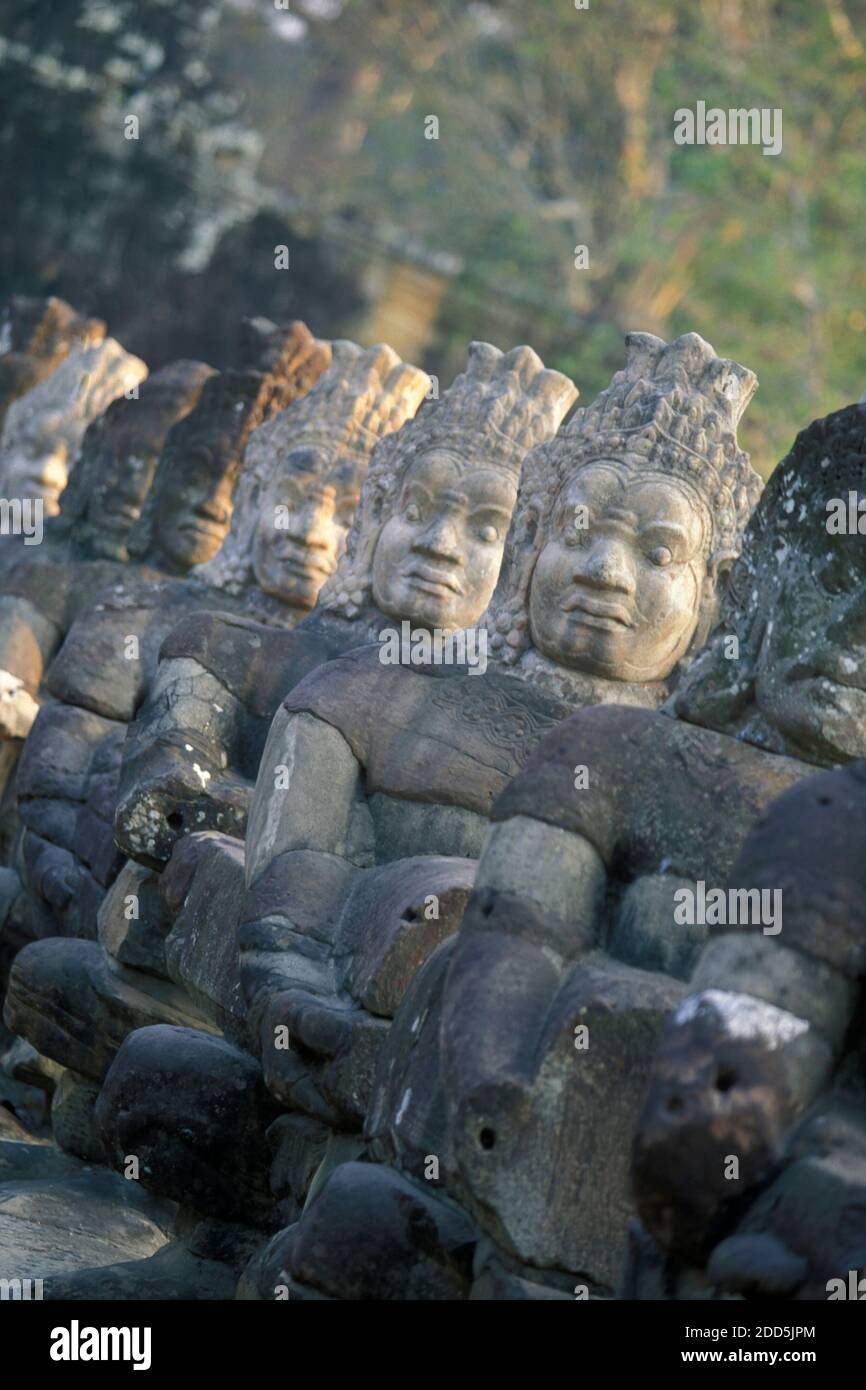 stone face at the Bridge of the south gate to the Angkor Tom city in ...