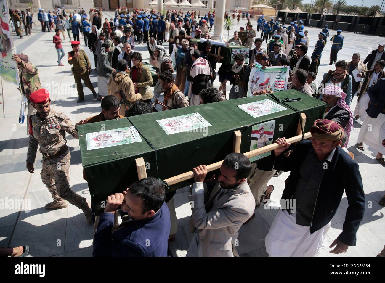 24 November 2020, Yemen, Sana'a: Houthi tribesmen carry coffins of ...