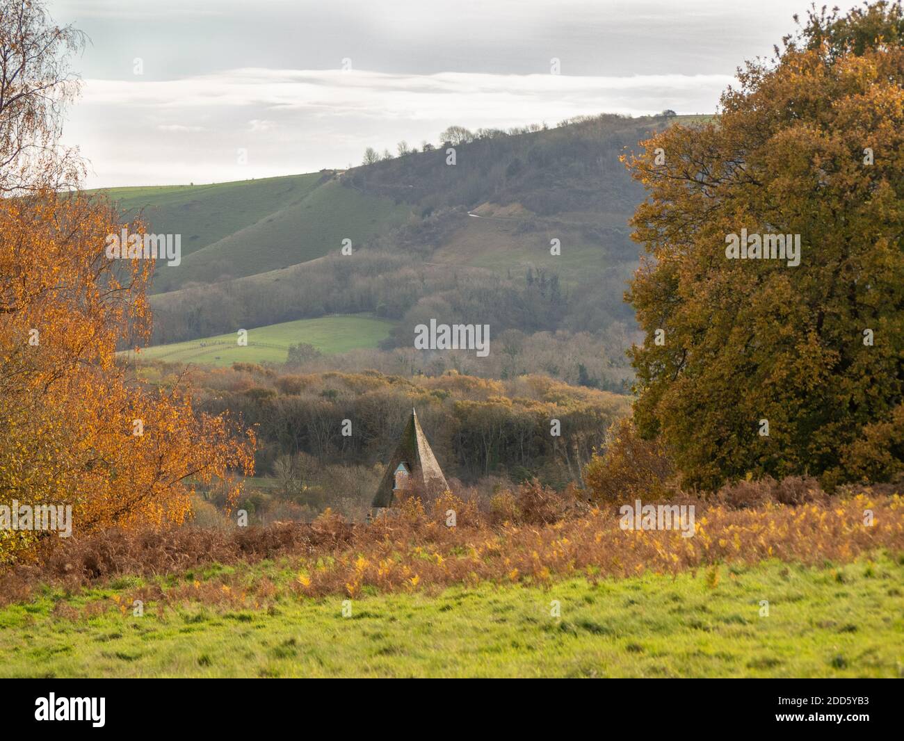 Hidden church and village in a valley with only spire visible Stock ...