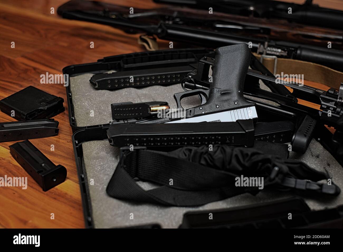 Pile of firearms dropped on the wooden floor, indoor close-up Stock ...