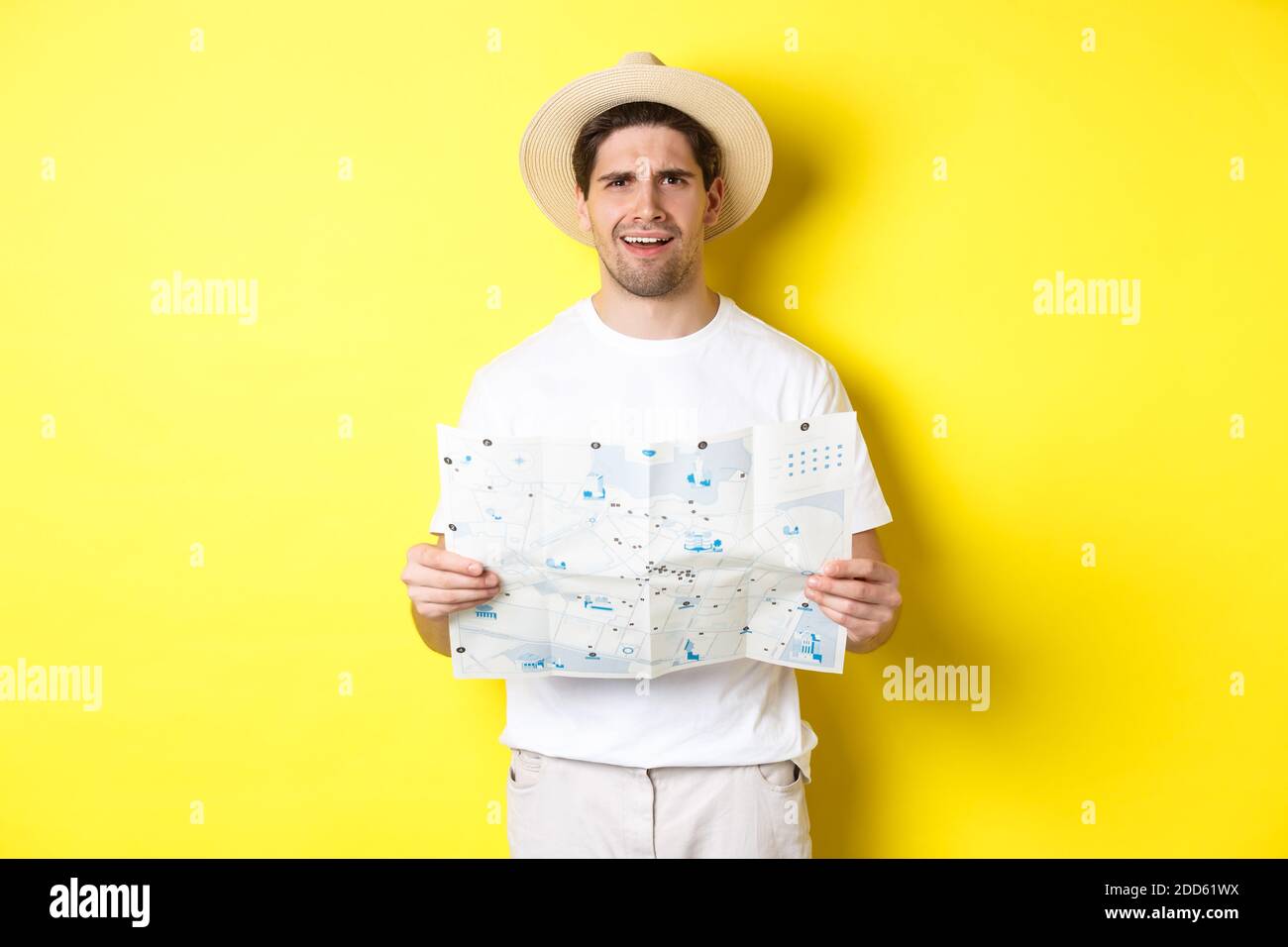 Travelling, vacation and tourism concept. Puzzled guy tourist cant ...