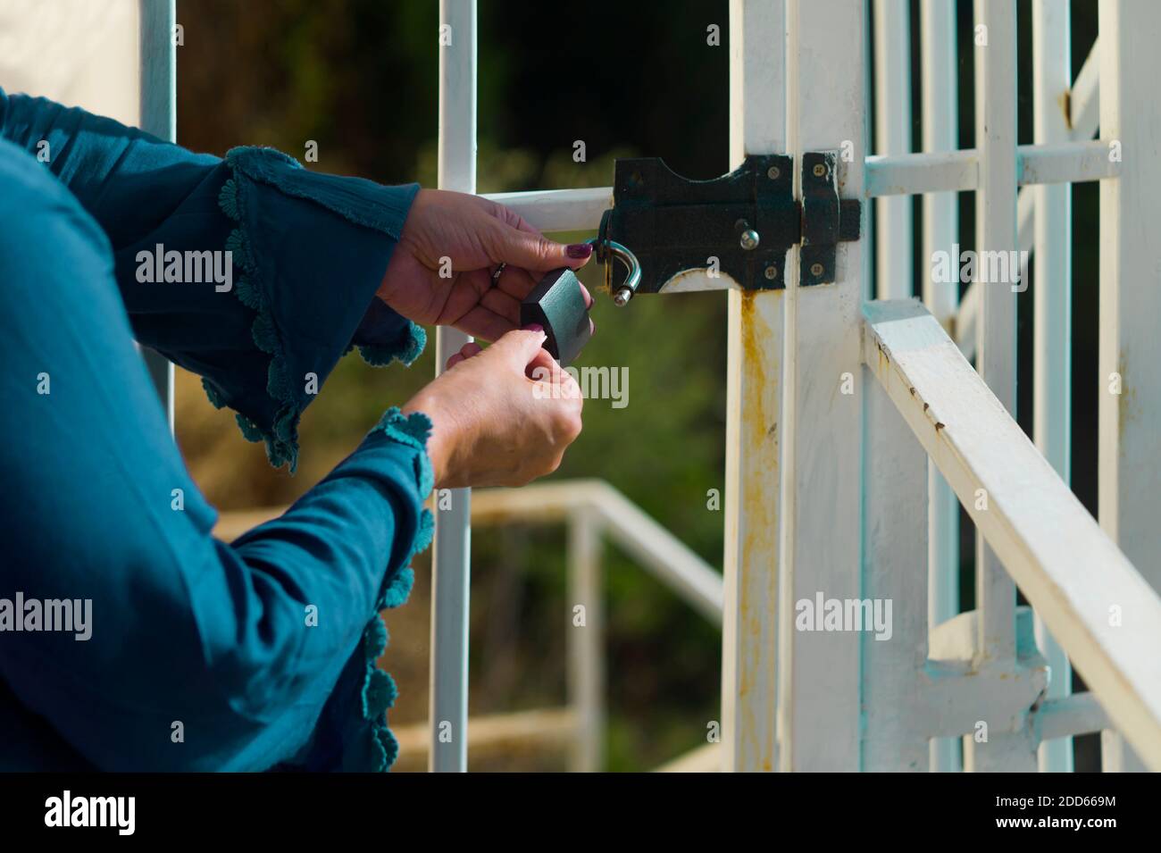 Hands locking hi-res stock photography and images - Alamy
