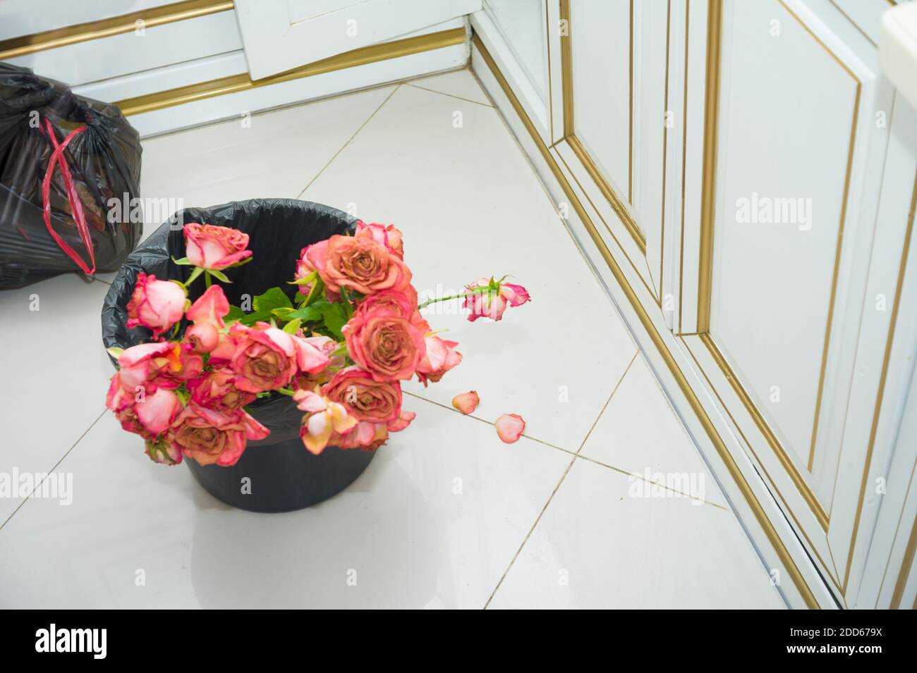 Thrown away bouquet into a rubbish bin, concept of end of love Stock ...