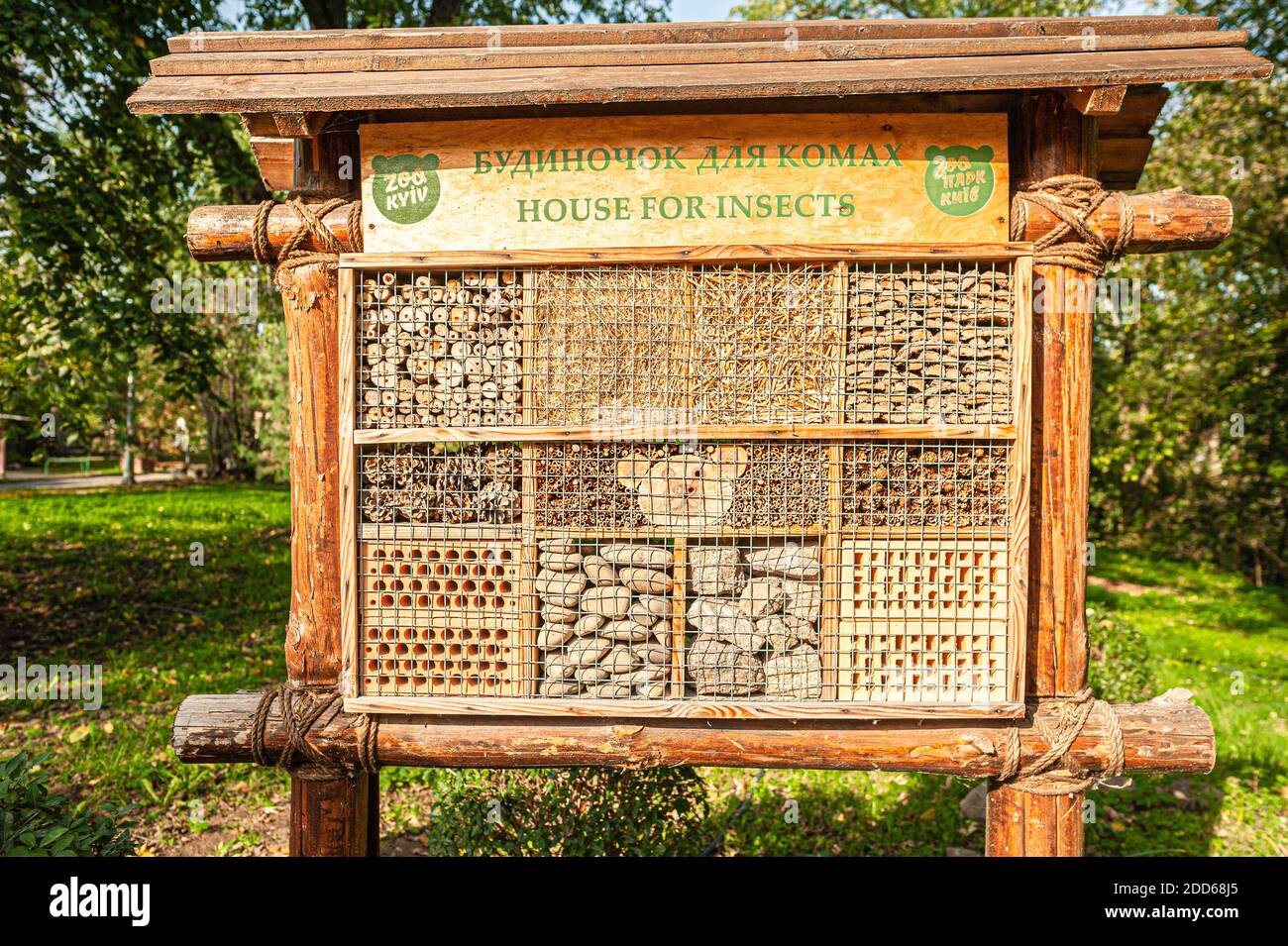 insect house for bugs and bees made of wood, bricks, cones and straw in ...