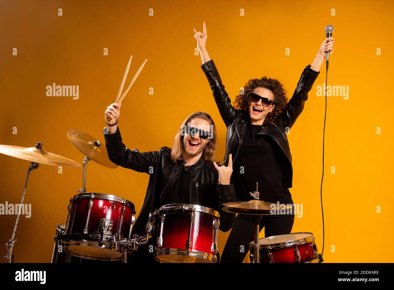 Photo of rock group band cool guy play instruments beat drum sticks ...