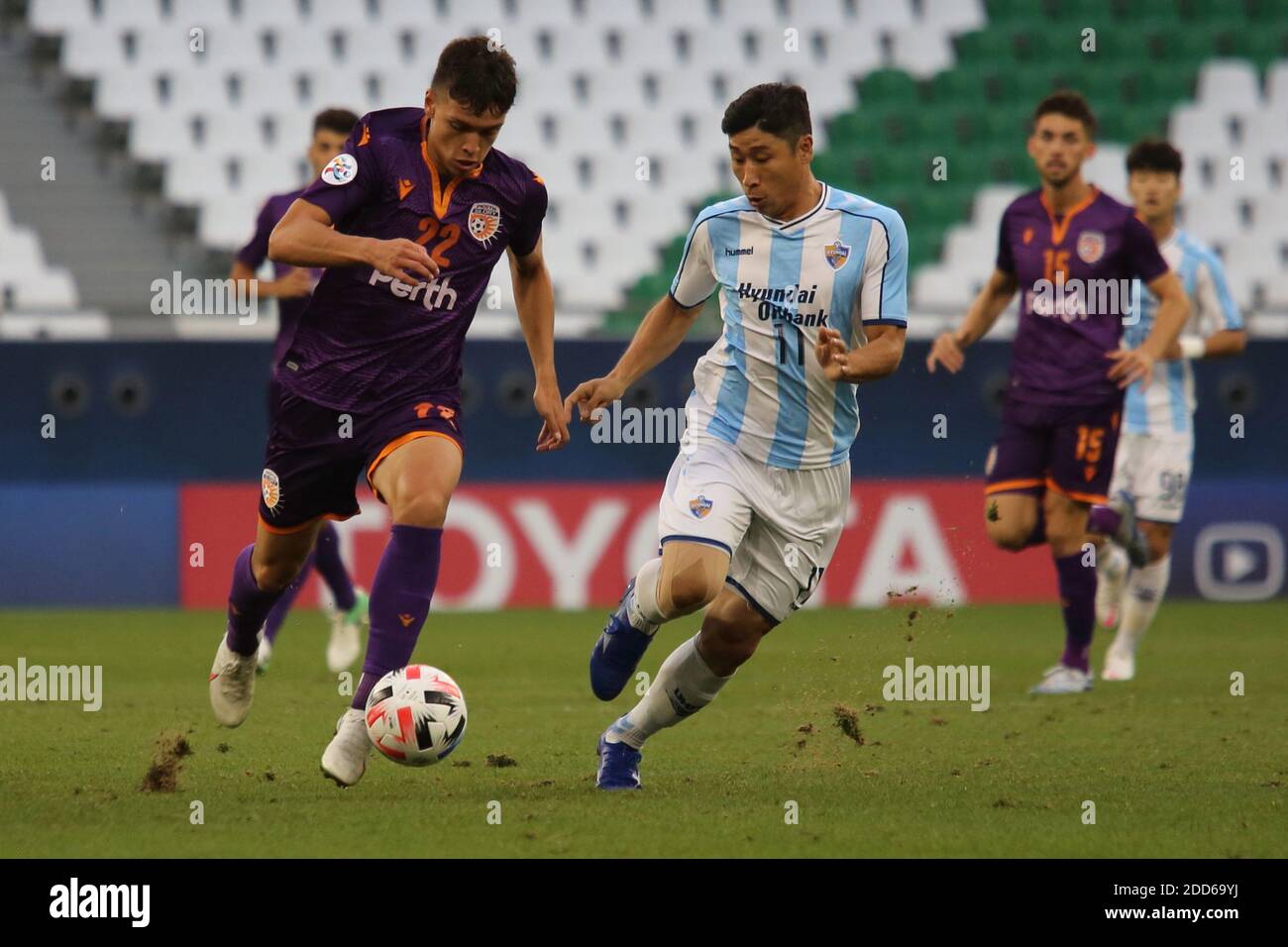 DOHA, QATAR - NOVEMBER 24: Joshua Rawlins of Perth Glory is chased down ...