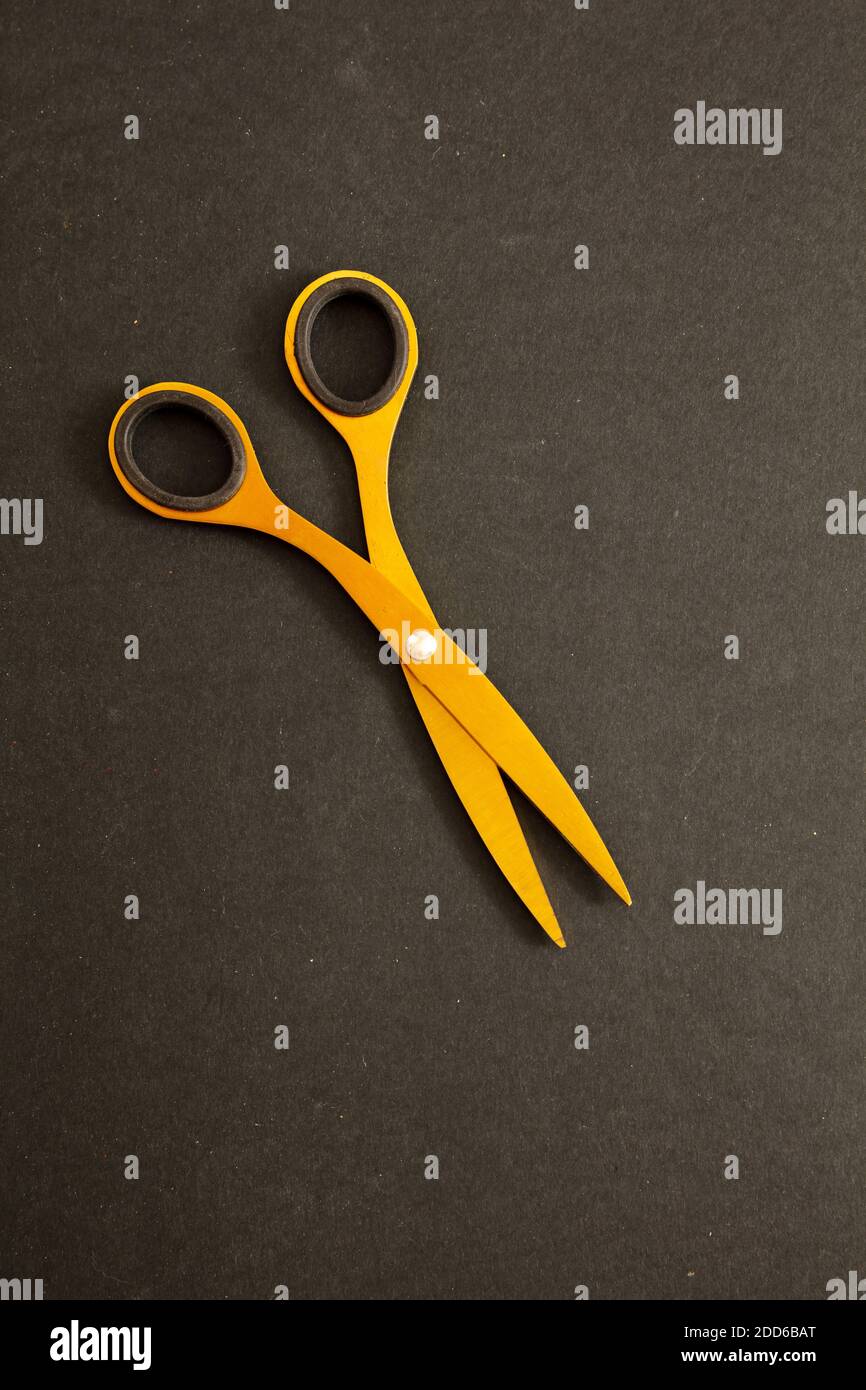 Scissors golden color isolated on black background, Tailor, barber ...