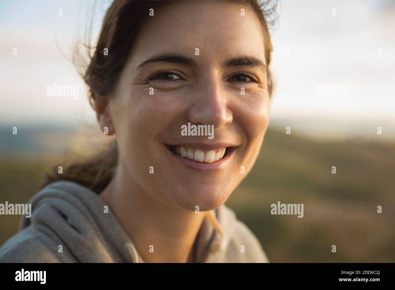 Beautiful woman with a natural smile at outdoor Stock Photo - Alamy