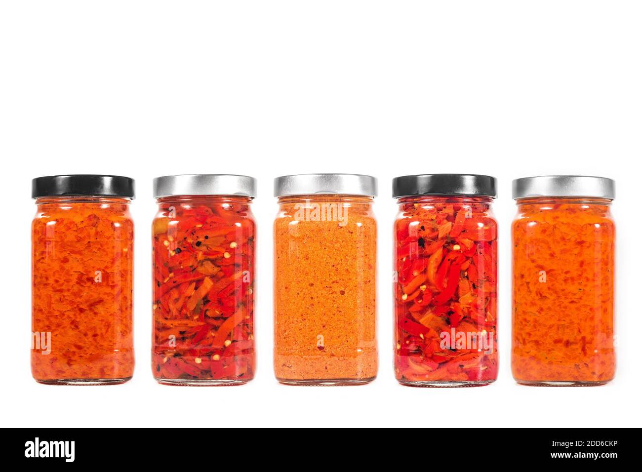 Homemade pickled peppers in jars (traditional Balkan winter food ...