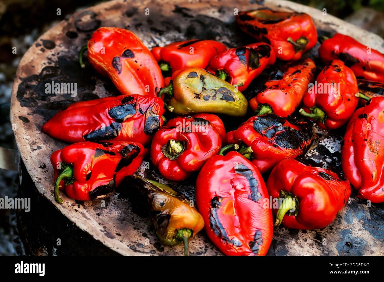 Grilling red peppers - part of the production of traditional Balkan ...