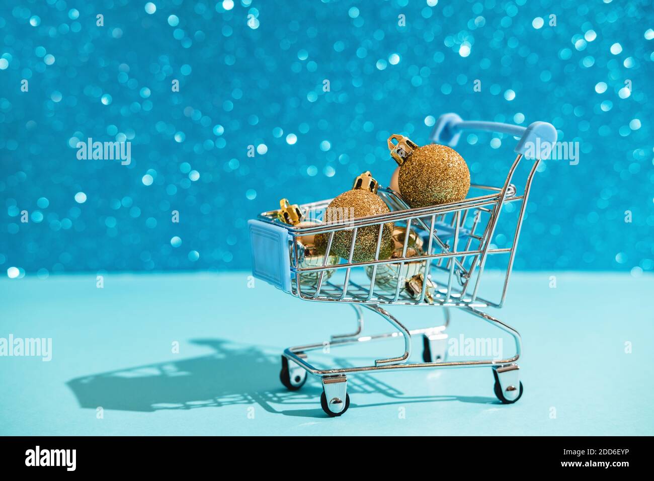 Minimal festive background with toy Christmas golden balls in ...