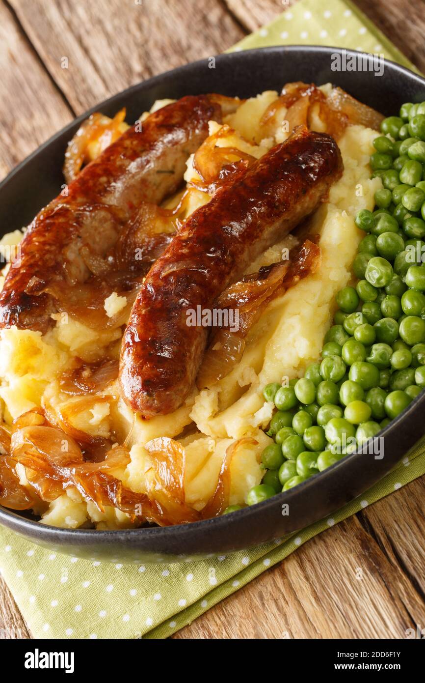 Bangers and Mash With Onion Gravy closeup in the plate on the table ...