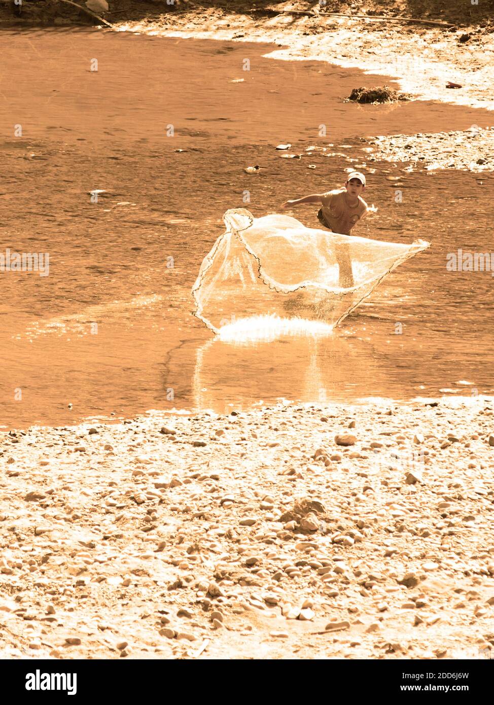 Sepia Photo of a Young Boy Fishing, Luang Prabang, Laos, Southeast Asia ...